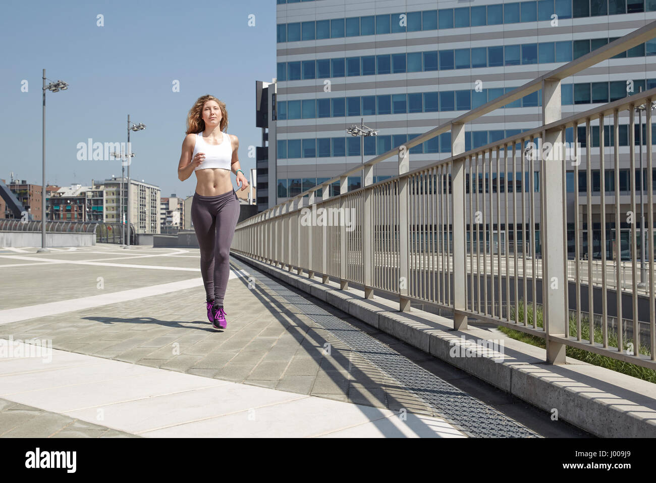 running woman in urban environment Stock Photo - Alamy