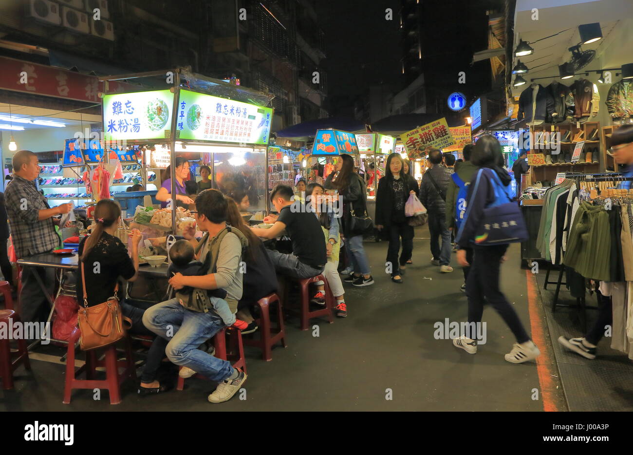 People visit Song Shan Raohe Night market in Taipei Taiwan. Raohe Night market is one of the ...
