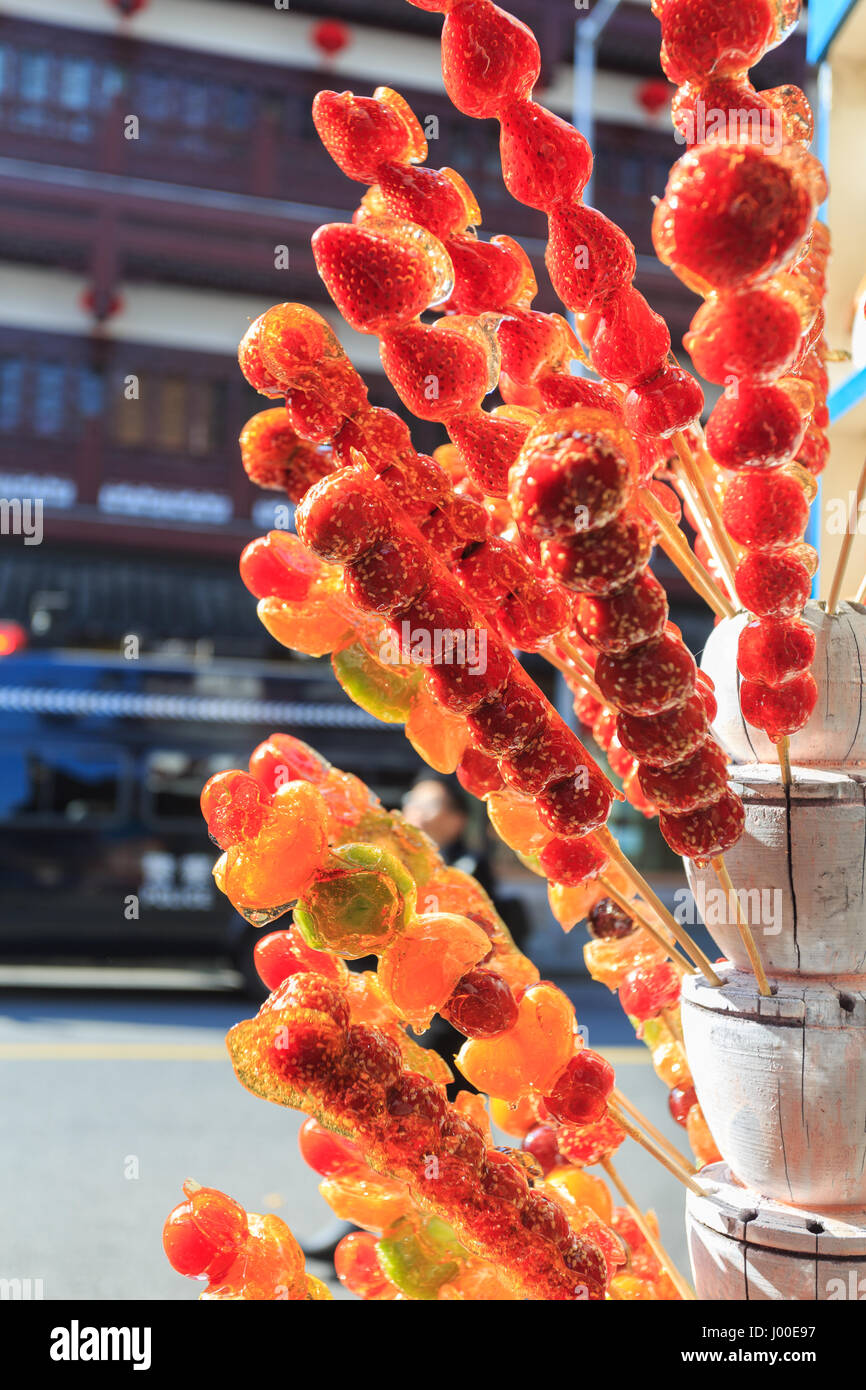 sugarcoated haws on a stick Stock Photo - Alamy
