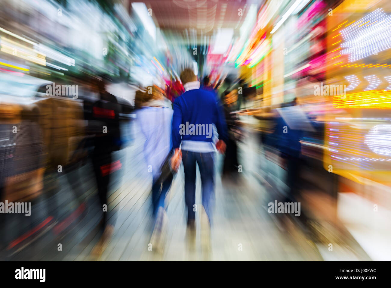 people walking at night in the city with creative zoom effect Stock ...