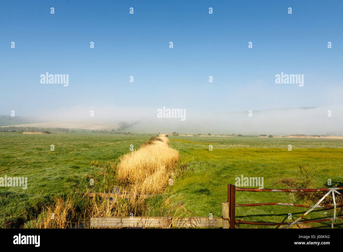 Litlington, UK. 8th Apr, 2017. UK weather. Fog shrouds the tops of ...