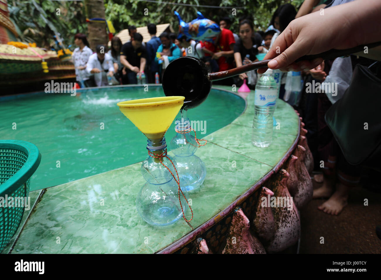 Visitors take water away with them in bottles Stock Photo - Alamy