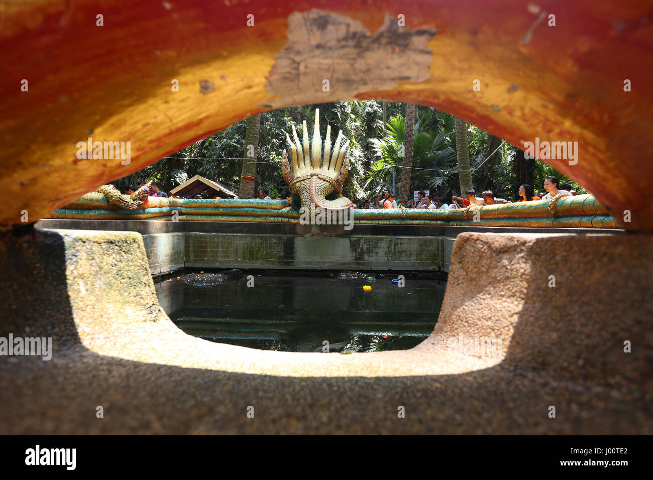 A view of the Naga Serpent statue through a kink in its tail Stock ...