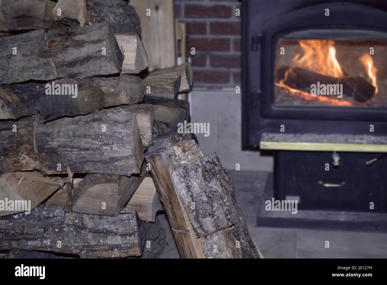 Getting warm by the fire side Stock Photo - Alamy
