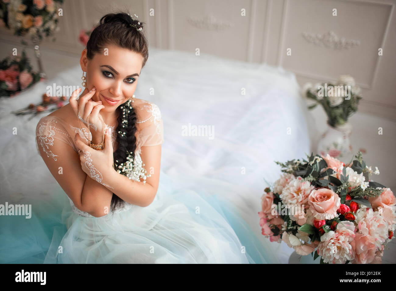 Bride sitting on bed hi-res stock photography and images - Alamy