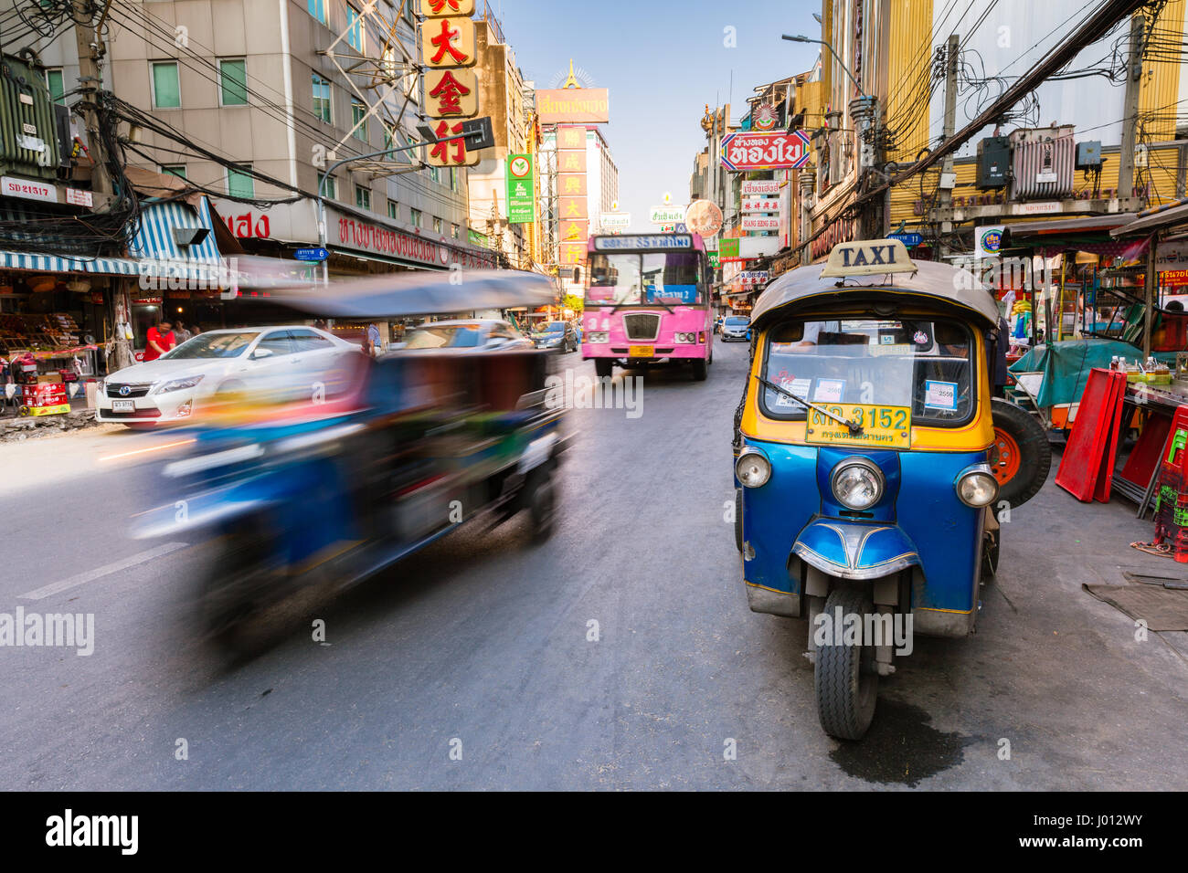Bangkok, Thailand - April 24, 2016: Tuk-tuk taxi parked near street market in Chinatown on April ...