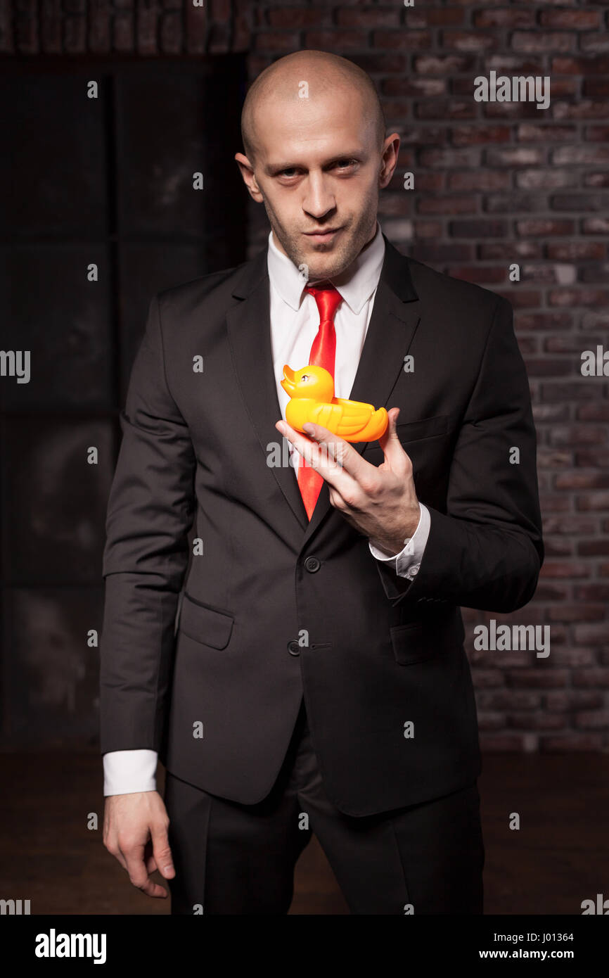 Contract killer in suit and red tie shows his fears and secrets ...