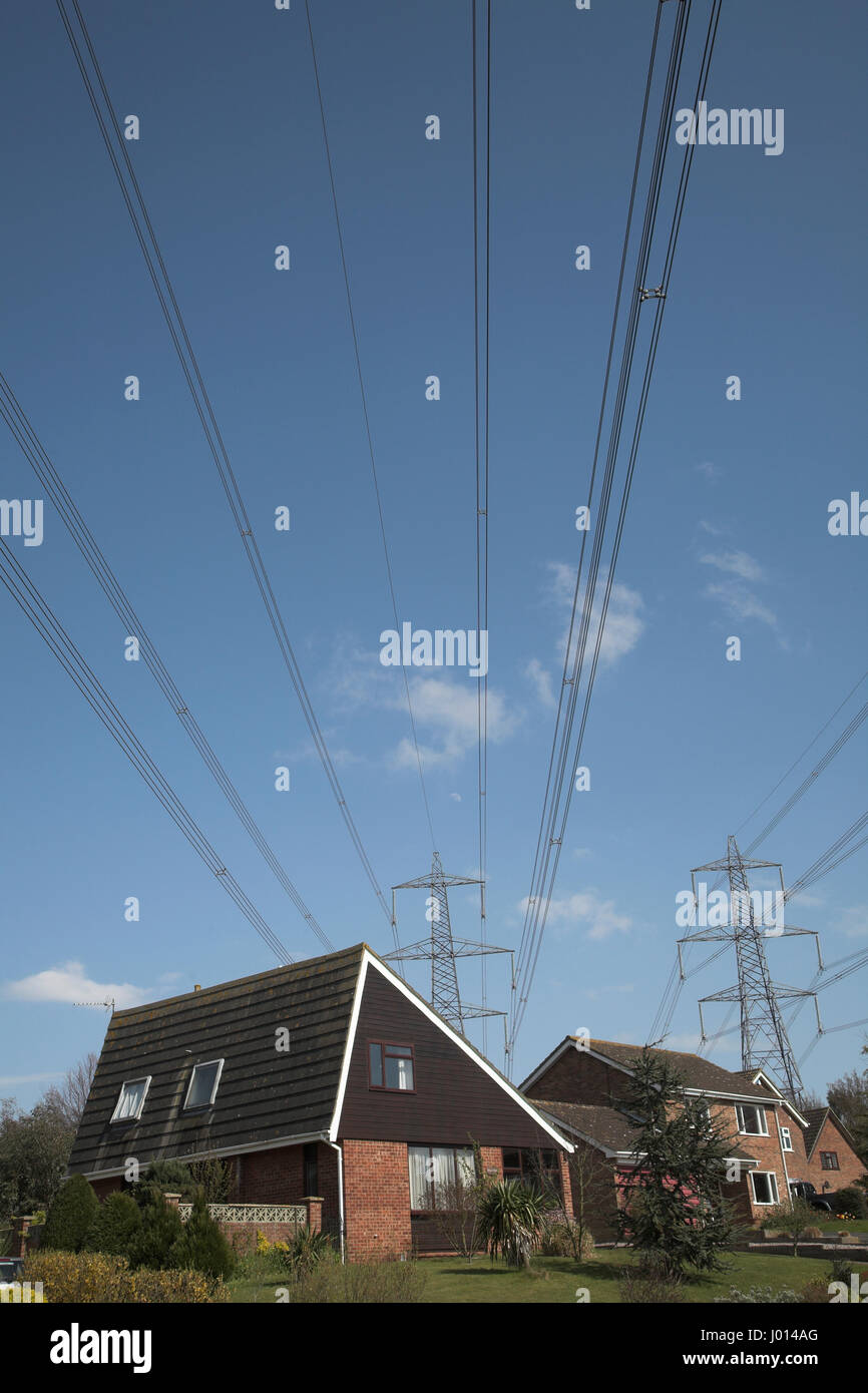 High voltage electricity power lines from Sizewell over suburban houses ...