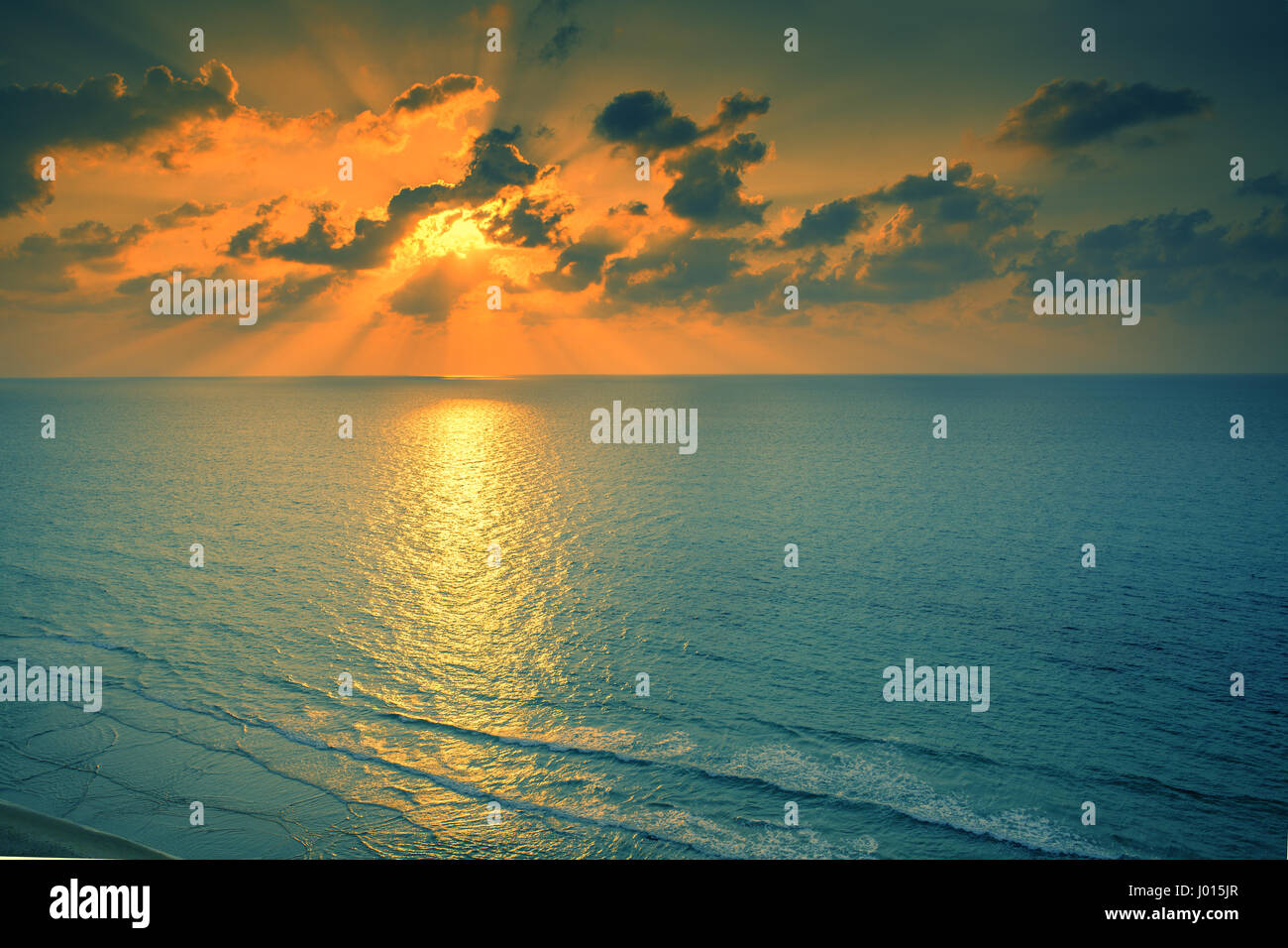 Early morning, sunrise over sea. Twilight time on the beach. Wild ...