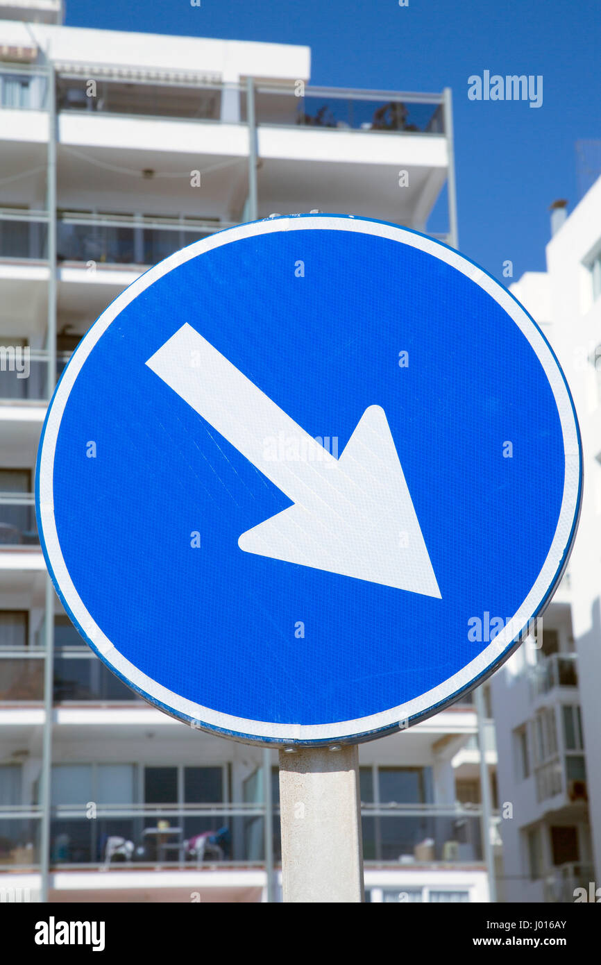 Down Arrow Sign in Urban Setting Stock Photo - Alamy