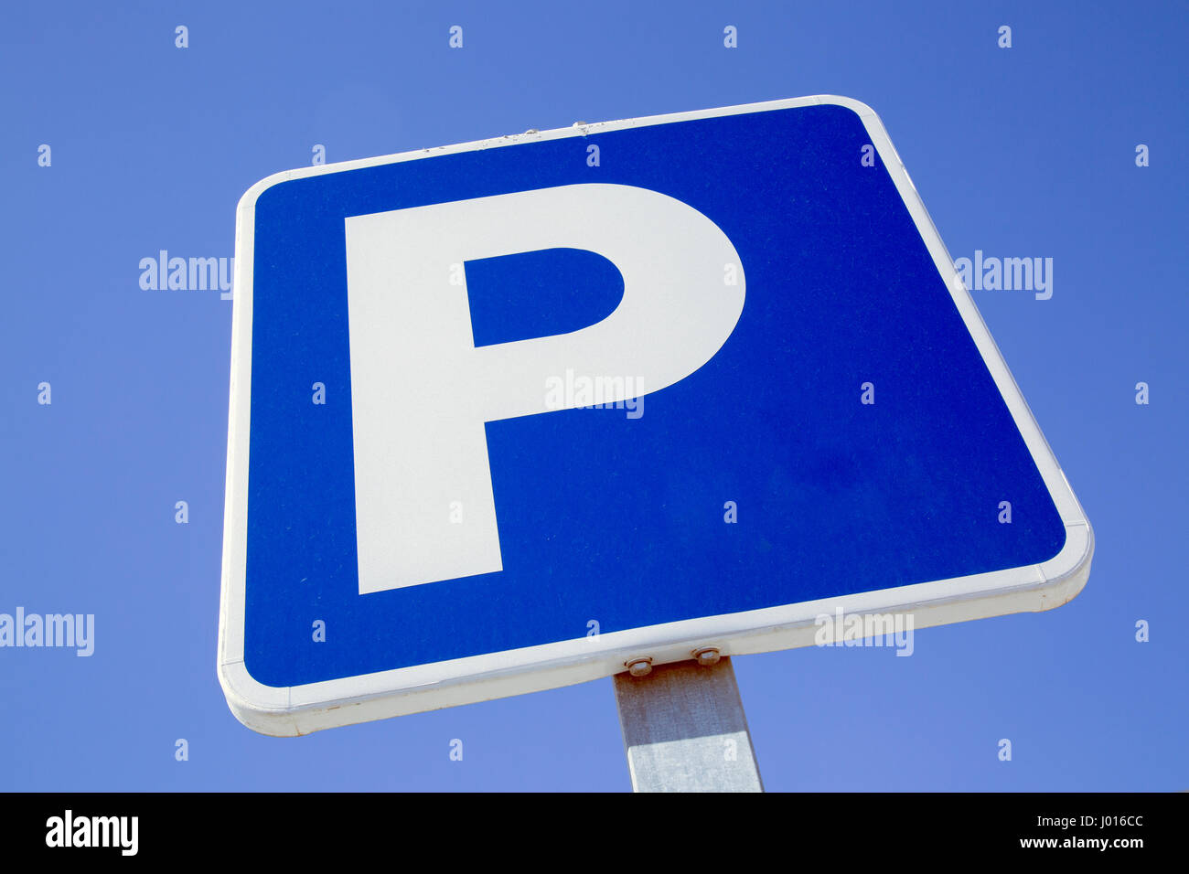 Blue Parking Sign in Urban Setting Stock Photo - Alamy