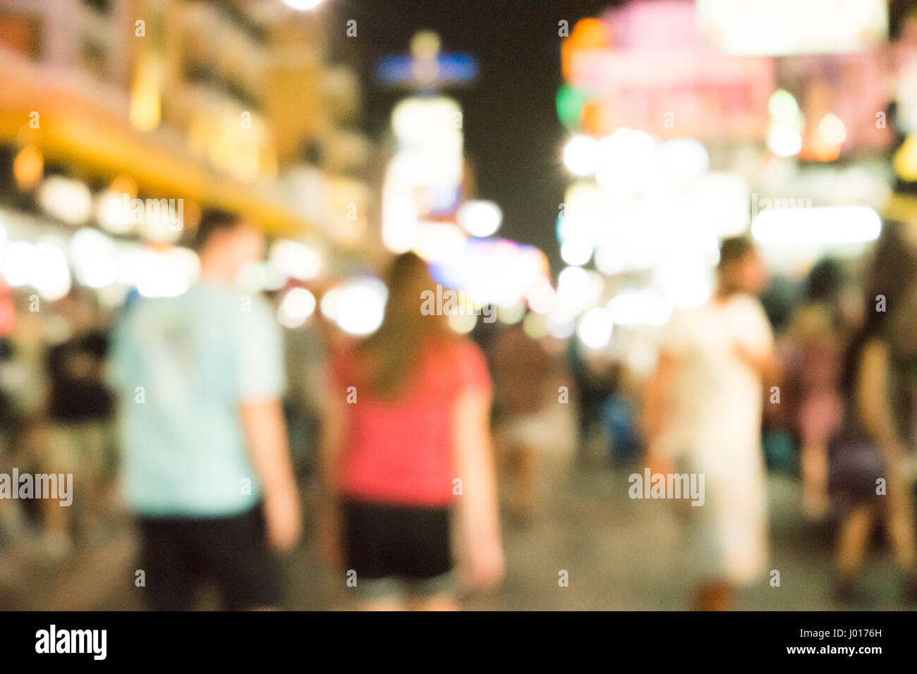 Blurred image of busy night life in the city Stock Photo - Alamy