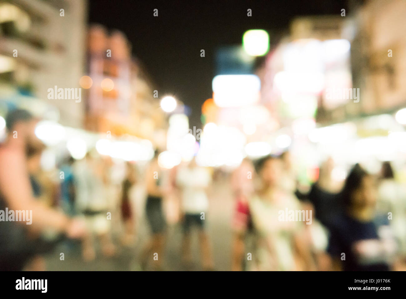 Blurred image of busy night life in the city Stock Photo - Alamy