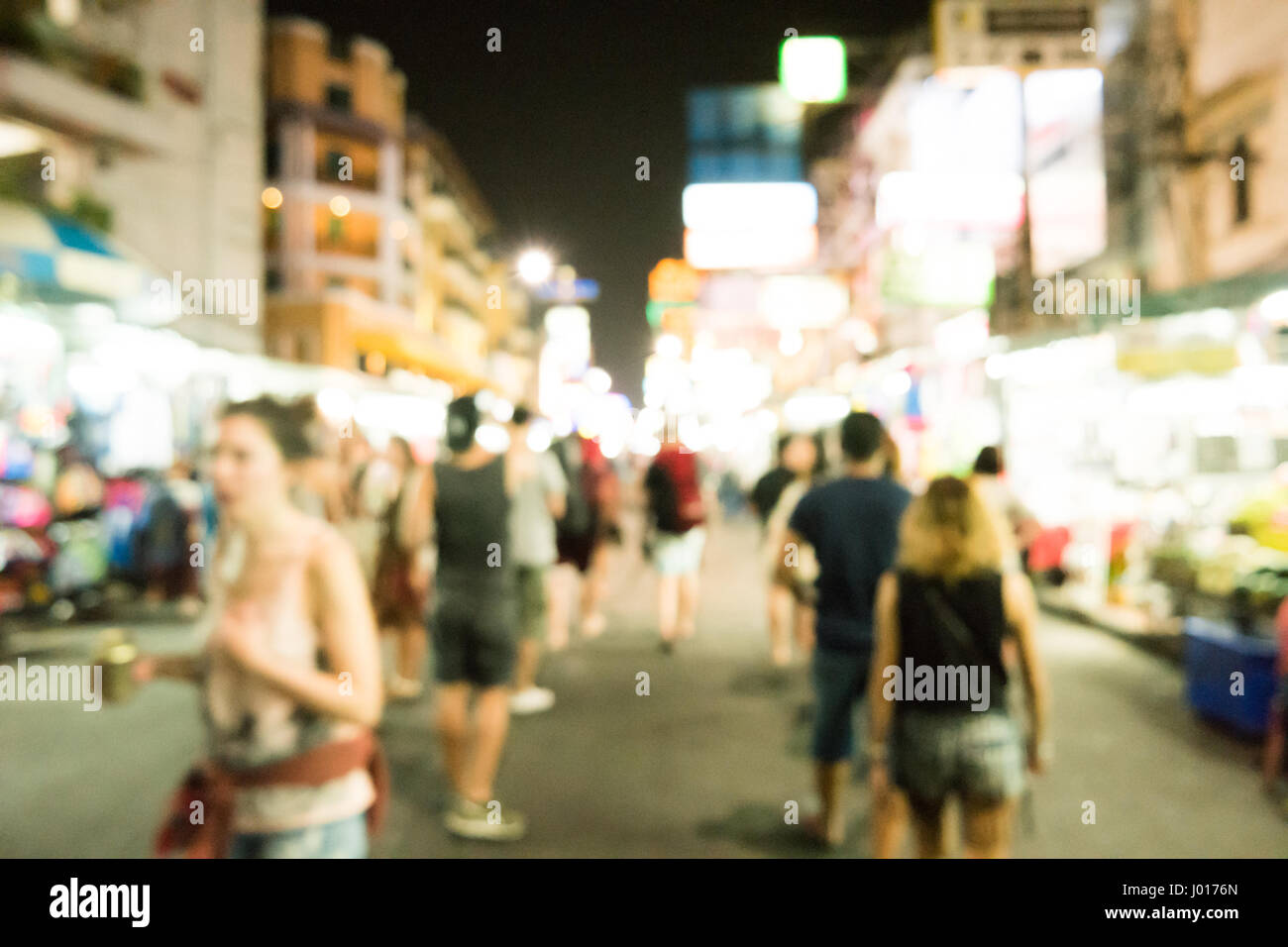 Blurred image of busy night life in the city Stock Photo - Alamy