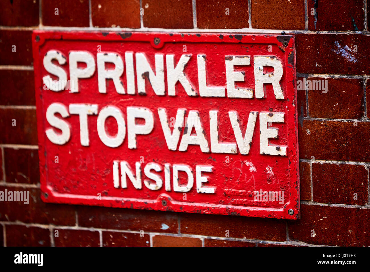A sign for a sprinkler stop valve Stock Photo - Alamy