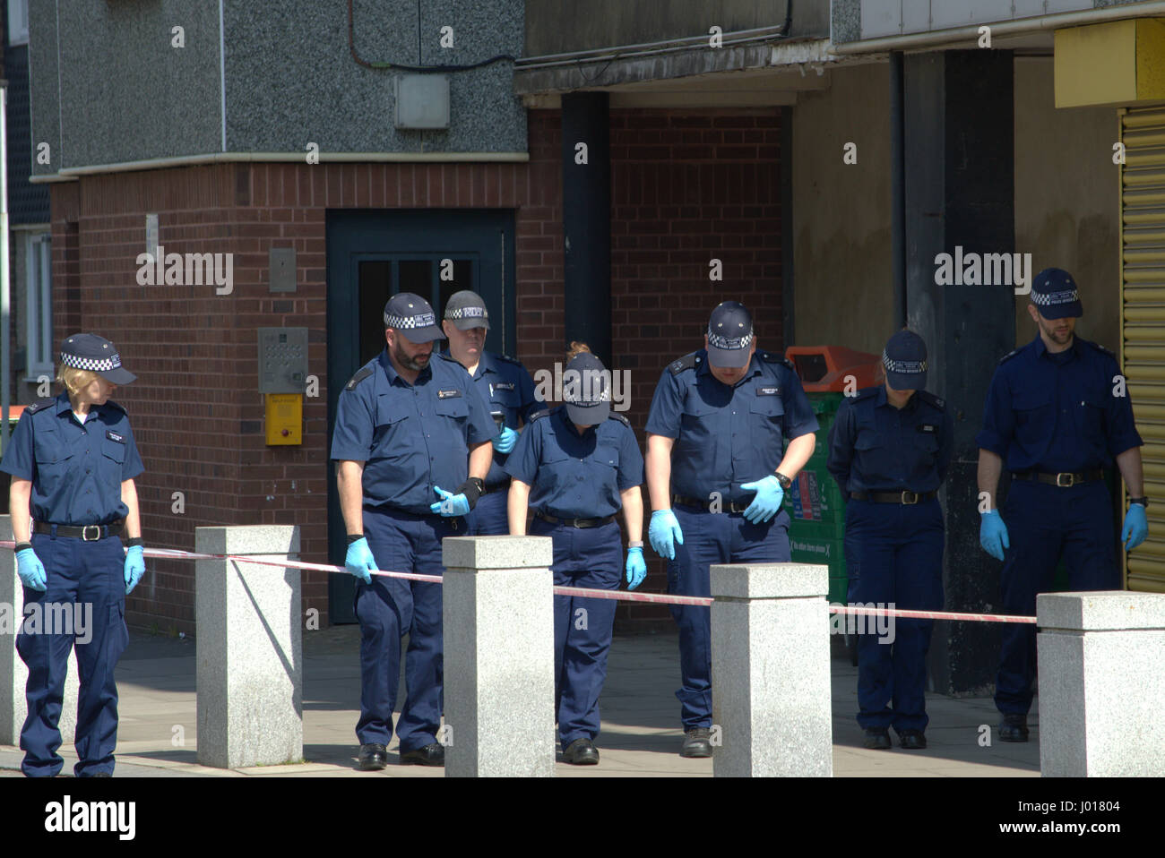 Police searching crime scene for evidence as part of murder inquiry in ...