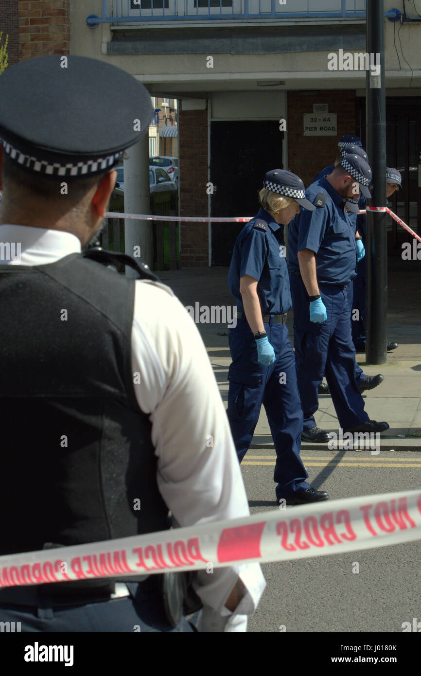 Police searching crime scene for evidence as part of murder inquiry in ...