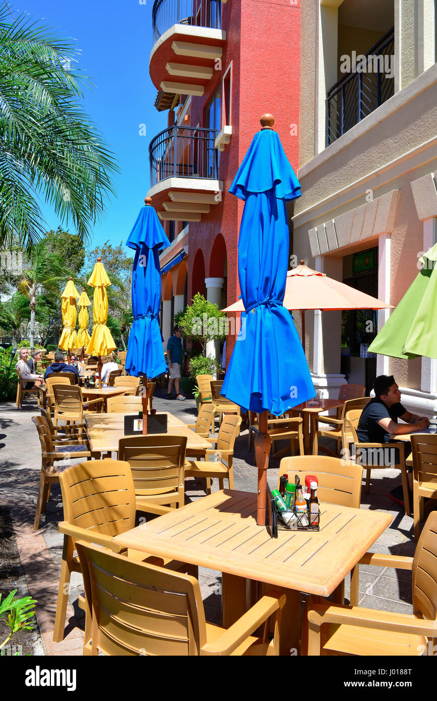 Sunny and colorful patio with diners at the Mango's Dockside Bistro ...