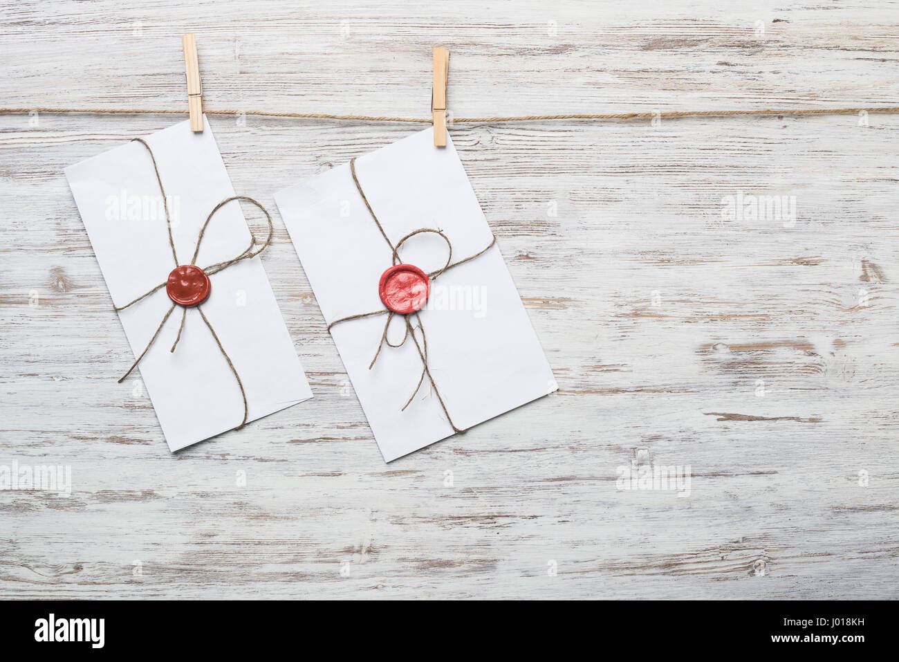 Mail envelope on rope Stock Photo - Alamy