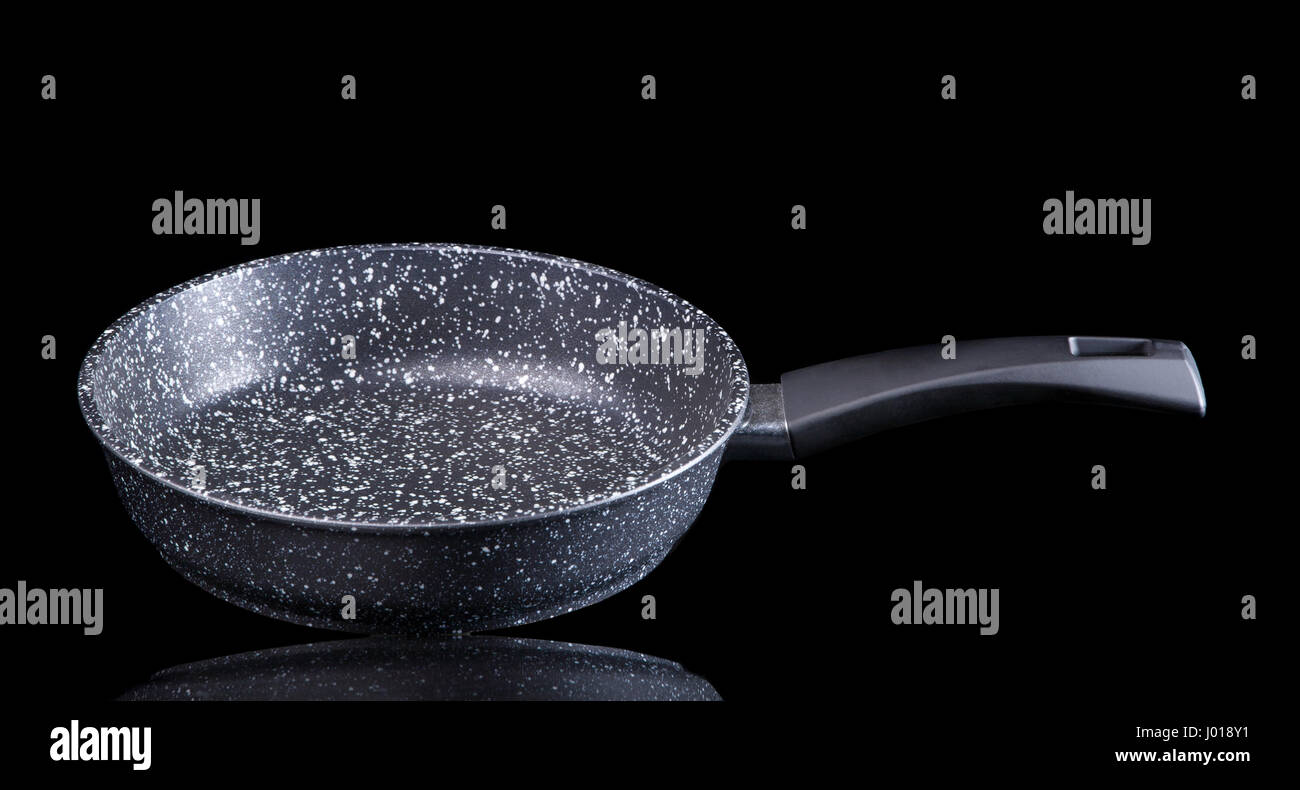 Stone Pan, angle view. Isolated on black background Stock Photo - Alamy
