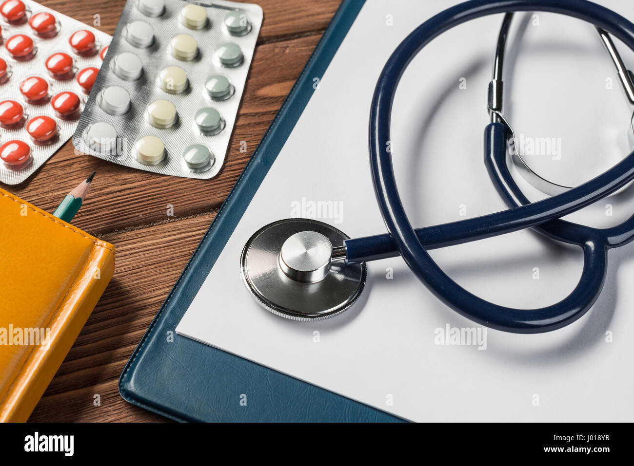 Desk of doctor with medicine things Stock Photo - Alamy