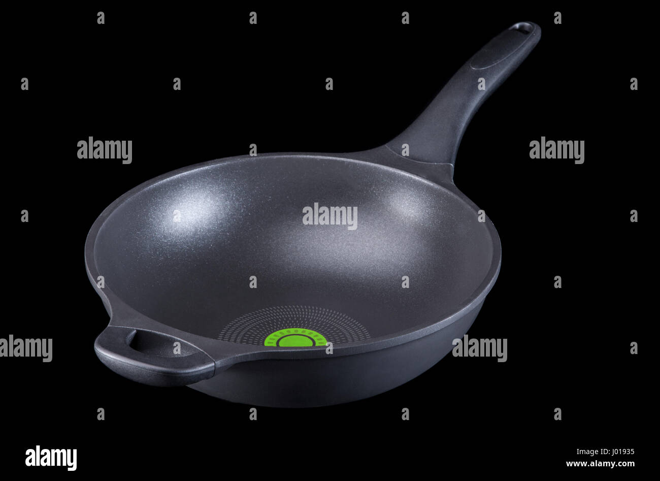 Teflon Pan, angle view. Isolated on black background Stock Photo - Alamy