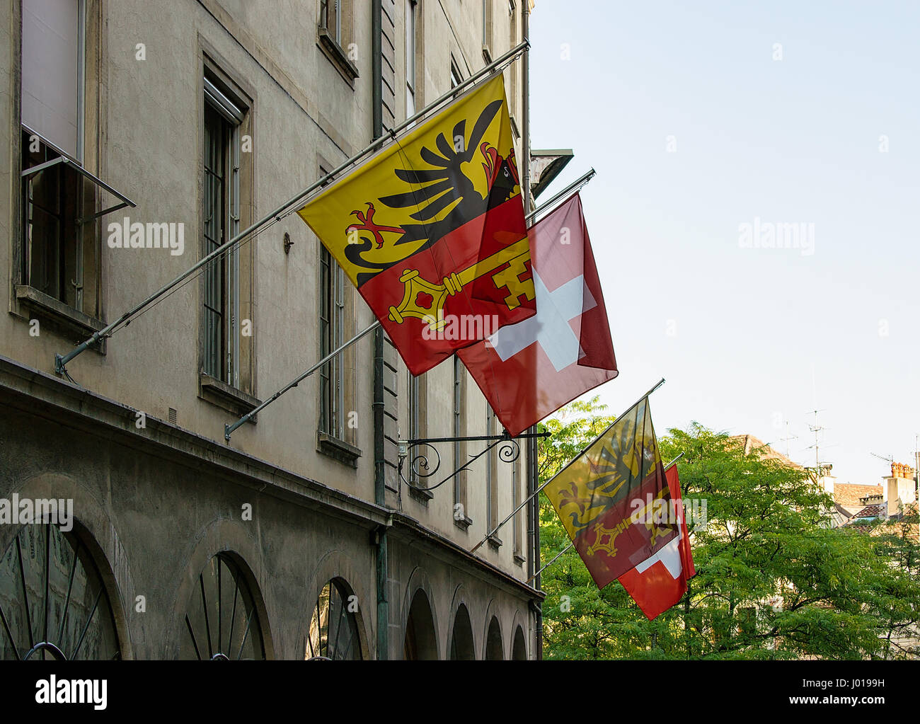 Street with Flags in Rue de Hotel-de-Ville at Geneva old town ...