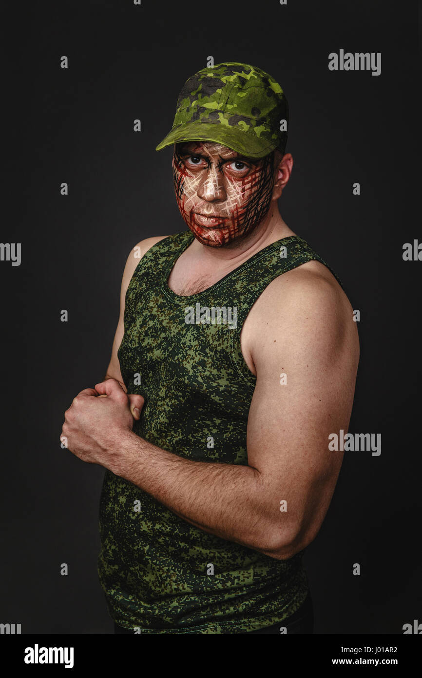 Portrait of Soldier with Military Style Camouflage on a Face. Portrait ...