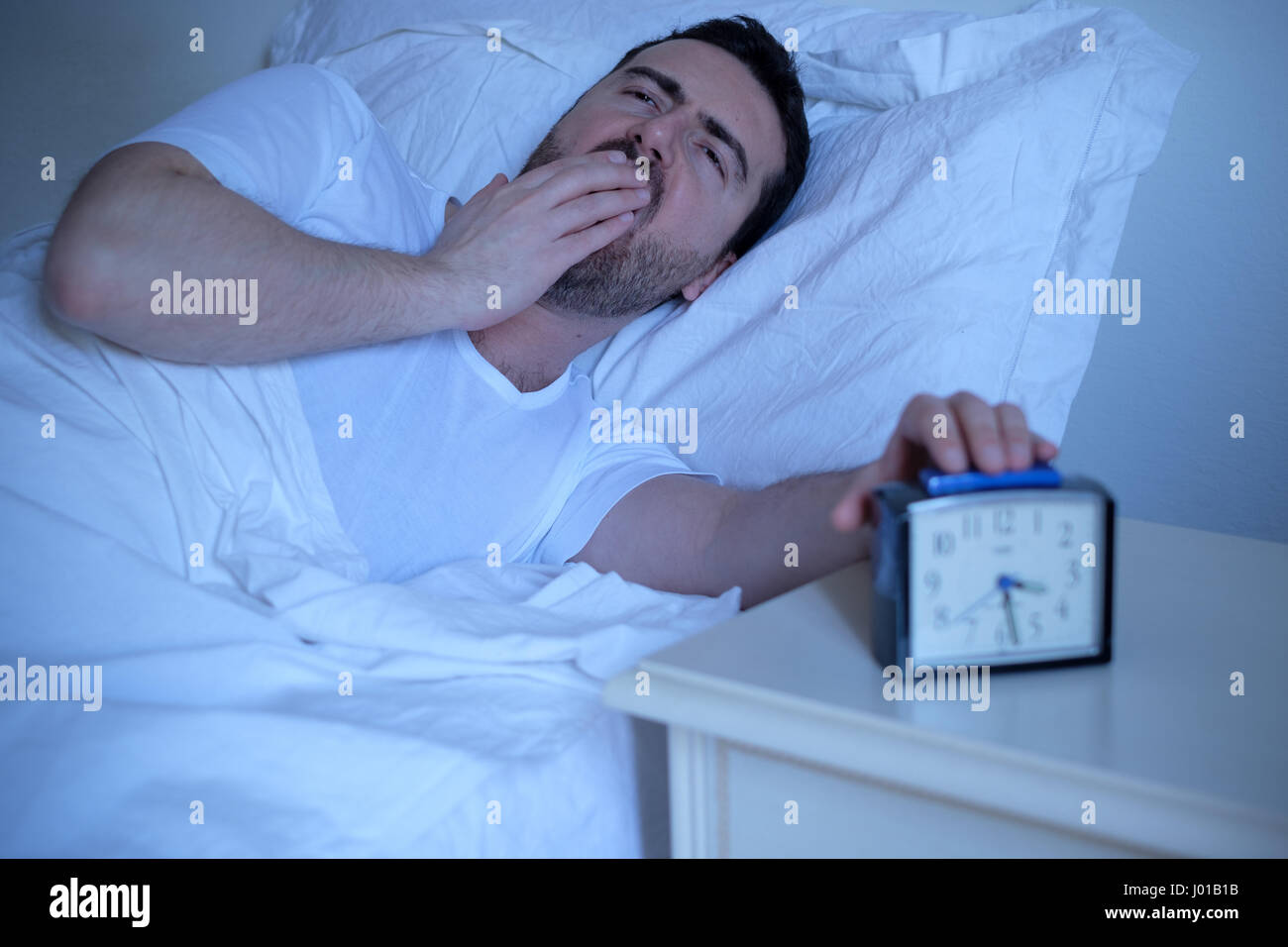 Man wake up bed hi-res stock photography and images - Alamy
