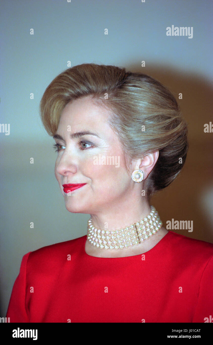 U.S. First Lady Hillary Rodham Clinton in a red ball gown and pearl ...