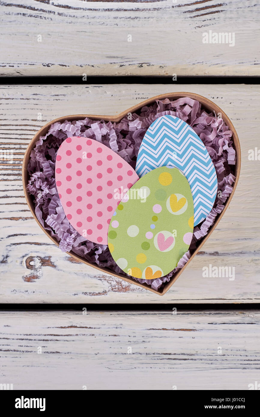 Easter gift box, wood background. Patterned paper egg cutouts. Make and ...