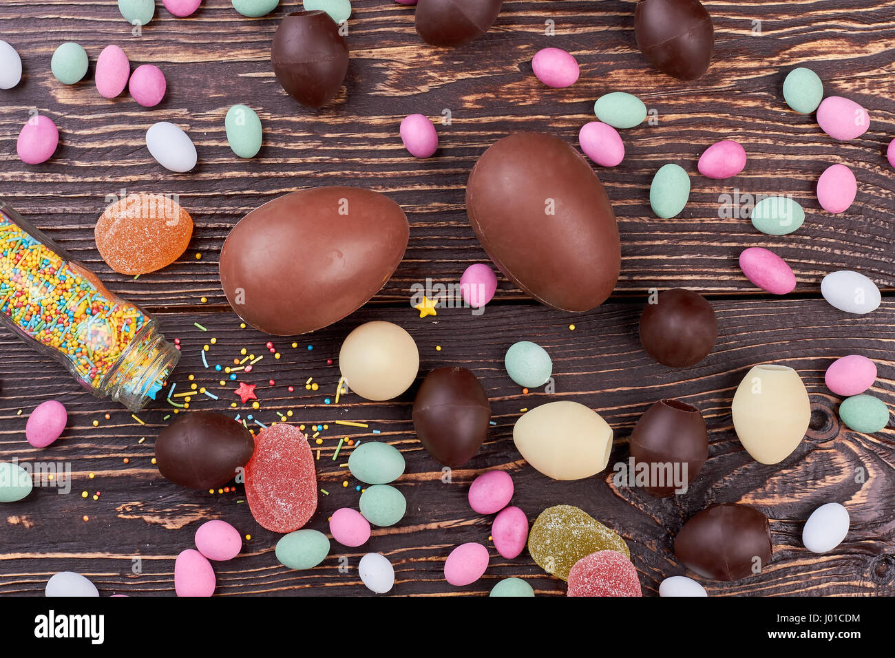 Candies on wood. Chocolate eggs and sprinkle dots. Party sweets ideas ...
