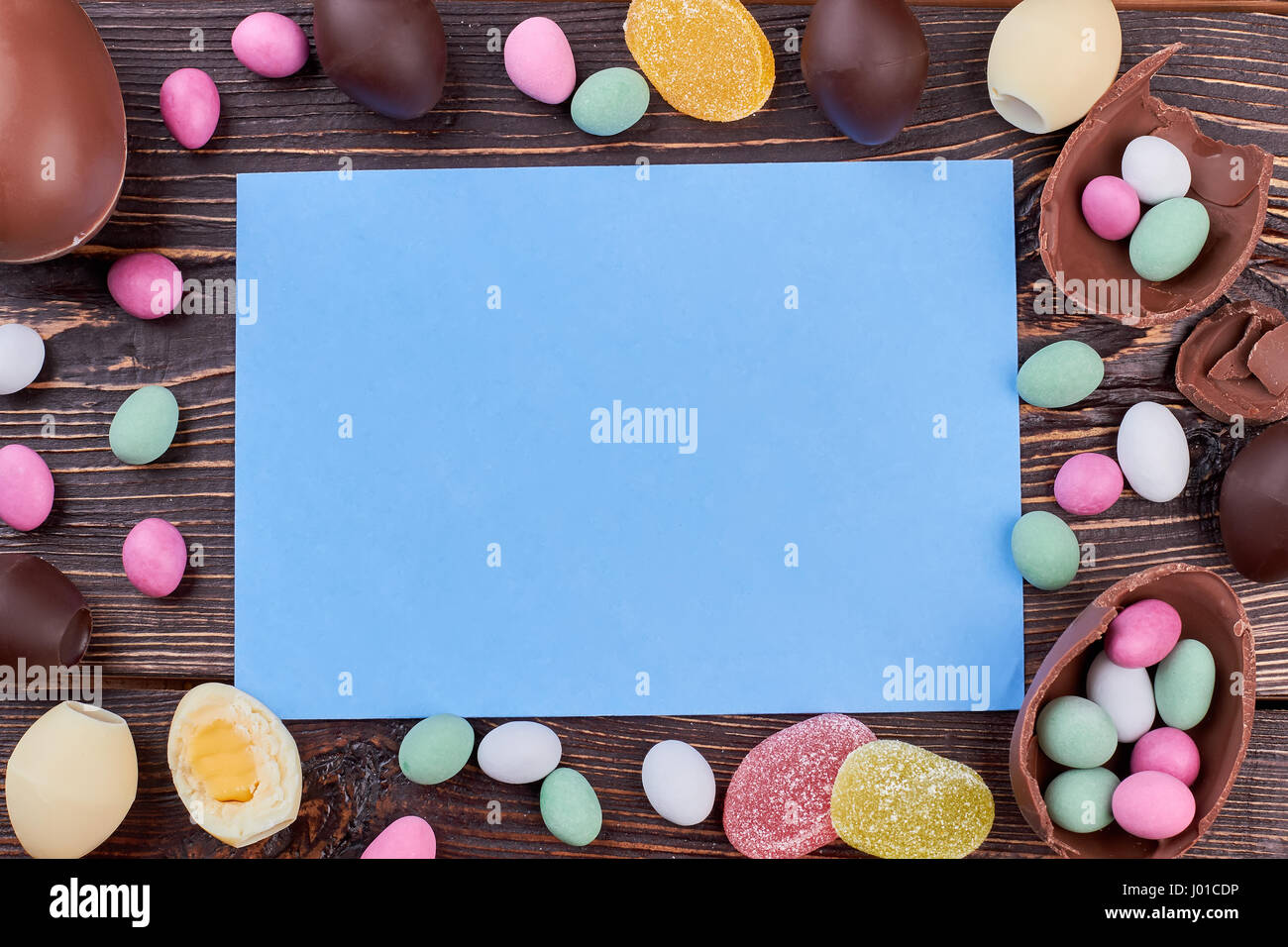 Sweets and blank card. Candies and wood texture Stock Photo - Alamy