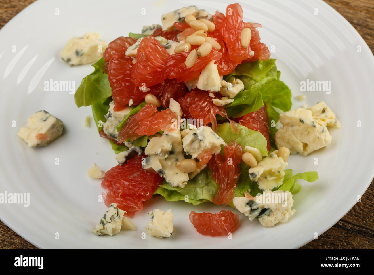 Grapefruit and blue cheese salad with cedar nut Stock Photo - Alamy