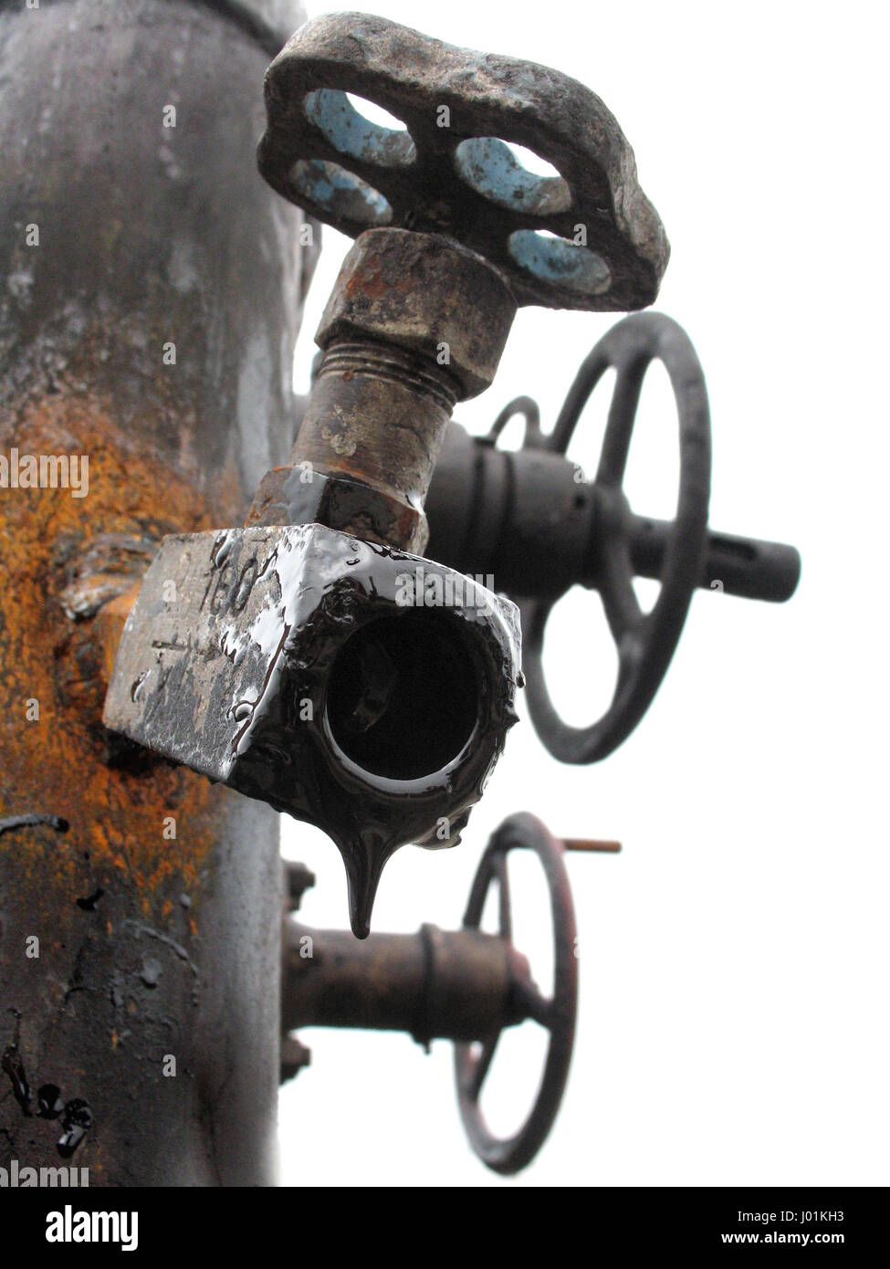 Old oil crane on white background Stock Photo - Alamy
