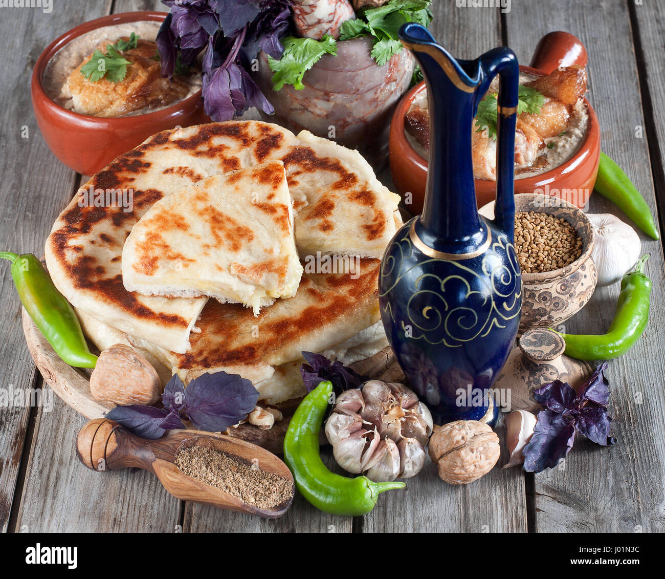 Traditional georgian meals - khachapuri and satsivi Stock Photo - Alamy