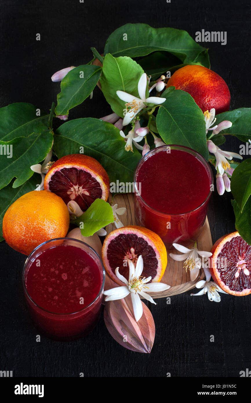 Fresh squeezed blood orange juice decorated with orange blossom. Low ...