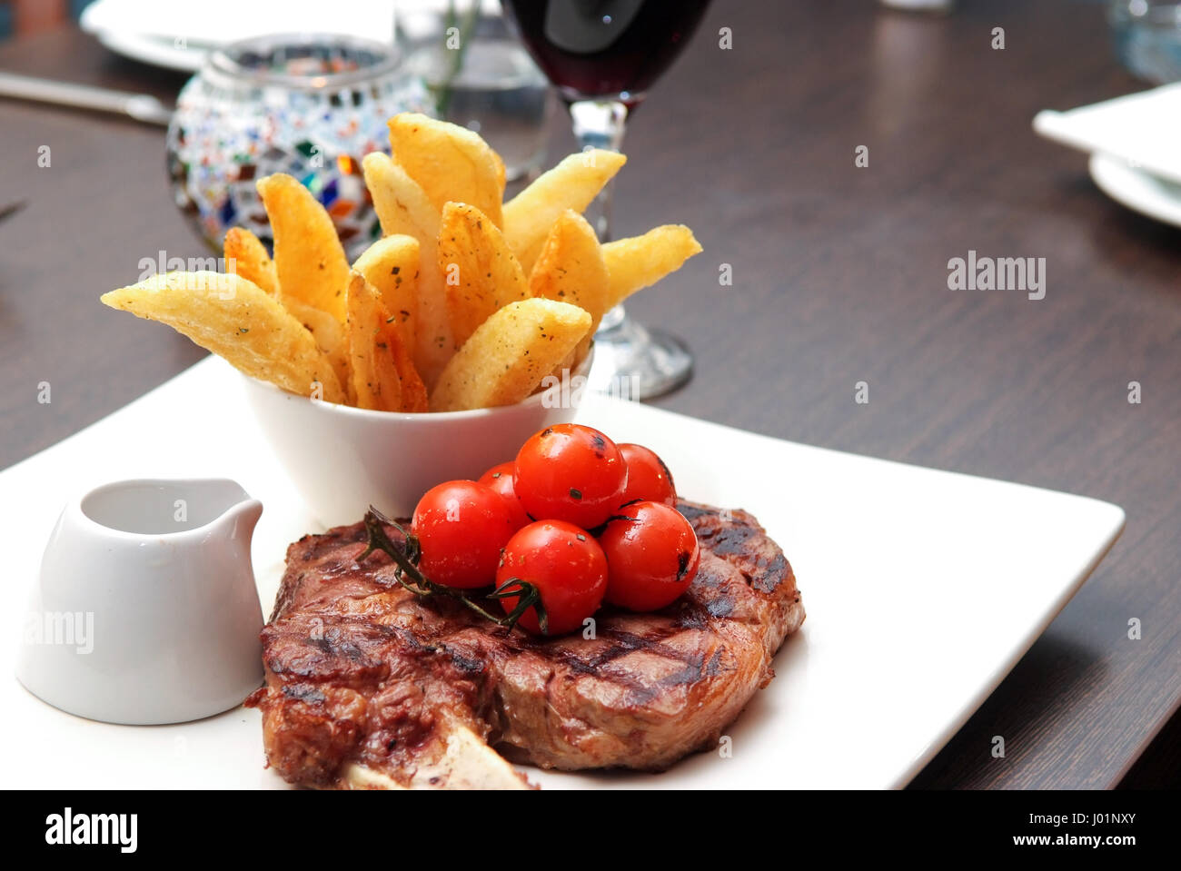 steak and chips meal in the restaurant Stock Photo - Alamy