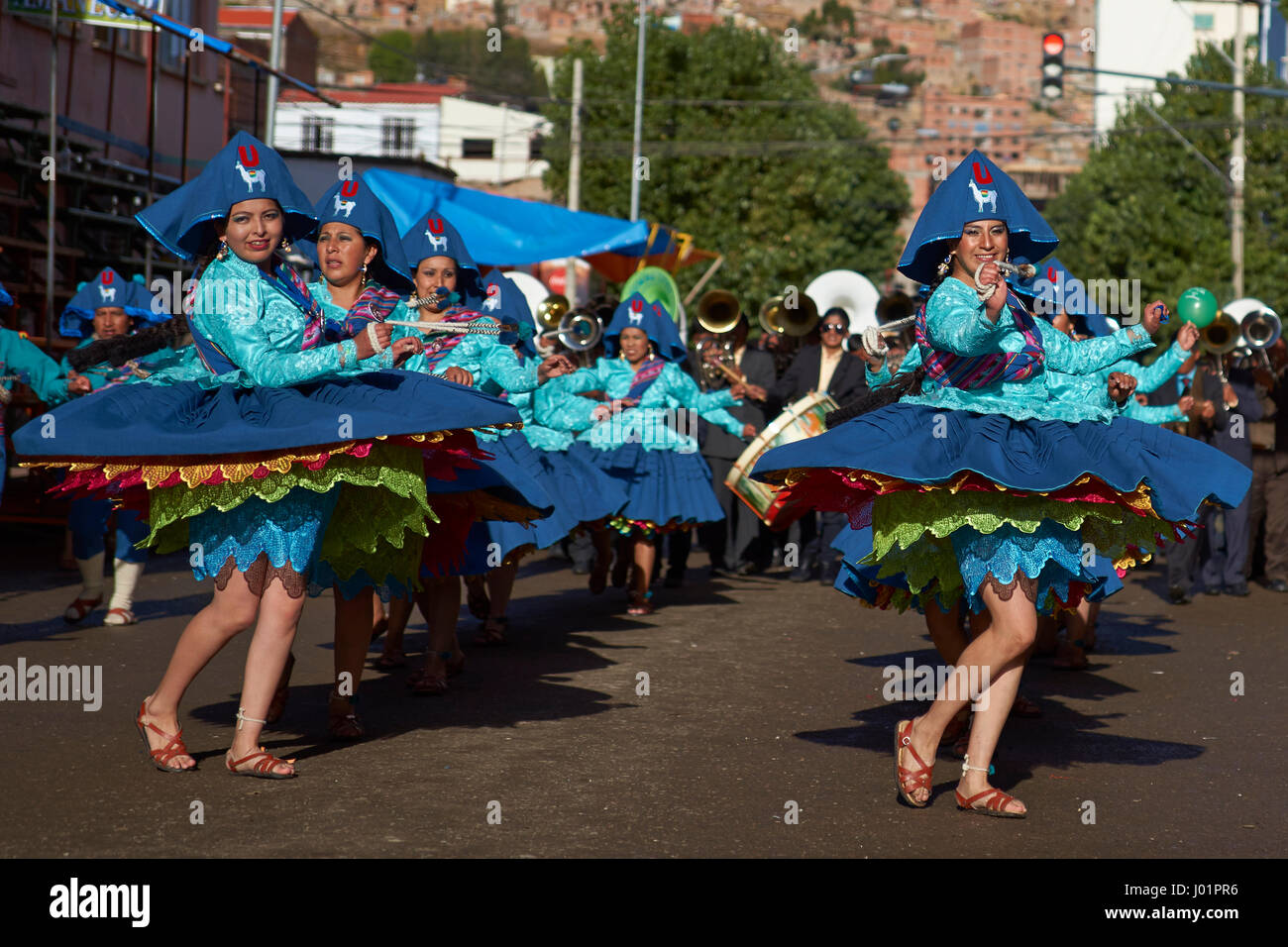 Llamerada dancers in ornate costumes performing as they parade through ...