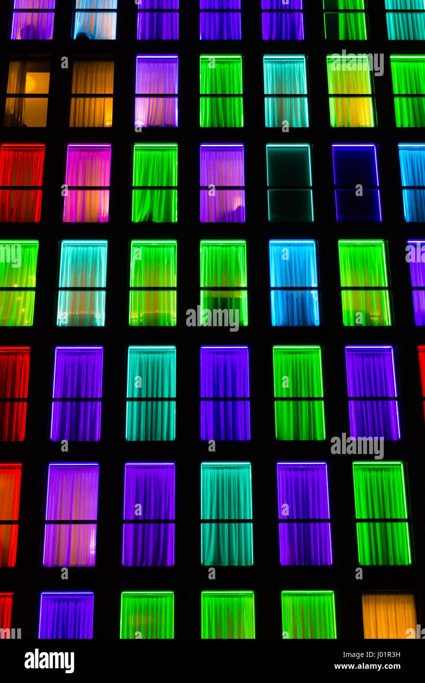 Colored windows texture. Windows illuminated by neon lights background ...