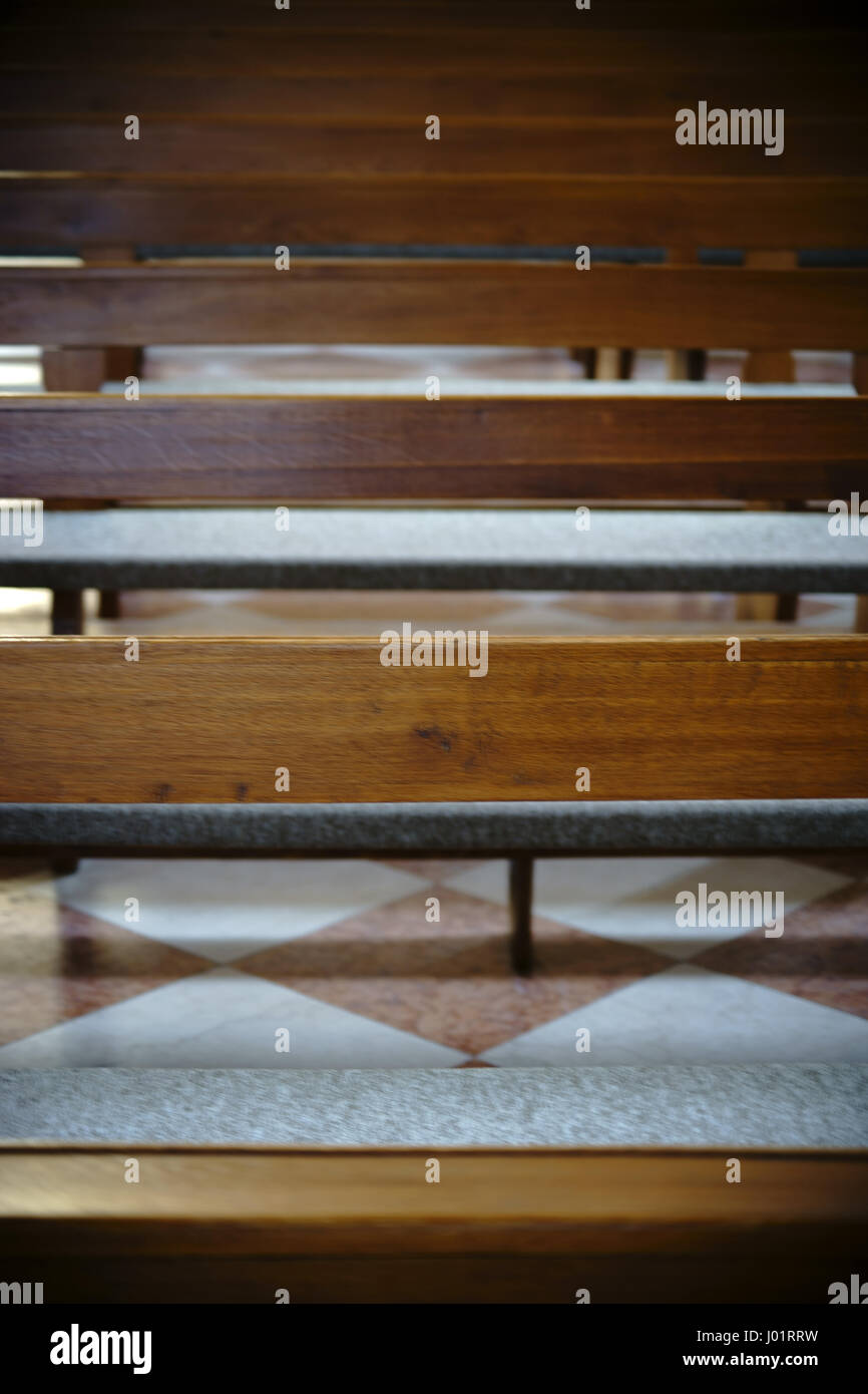 The close-up of a row lined up benches in a church Stock Photo - Alamy