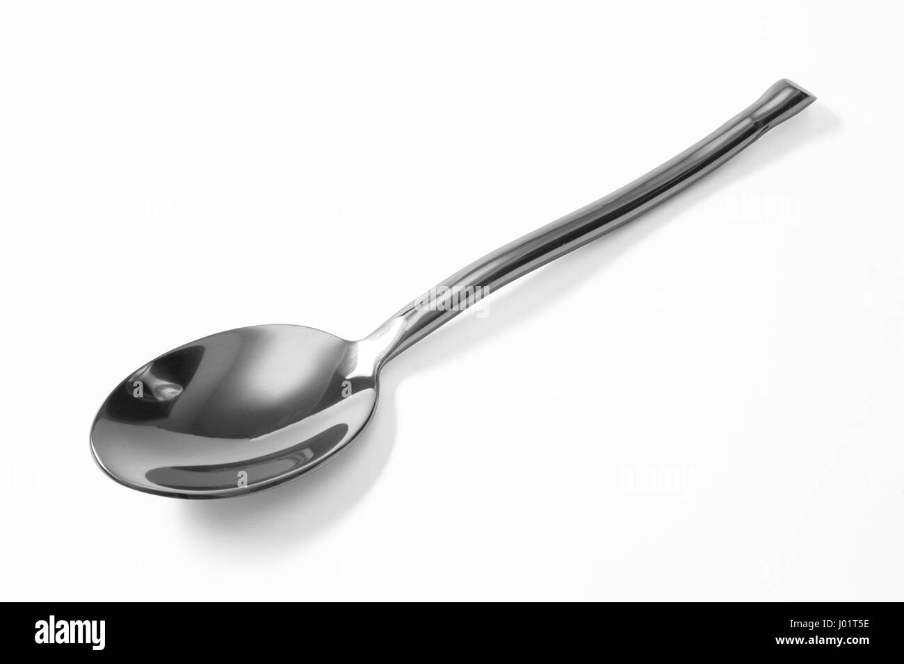 Stainless steel glossy metal kitchen spoon isolated over the white ...