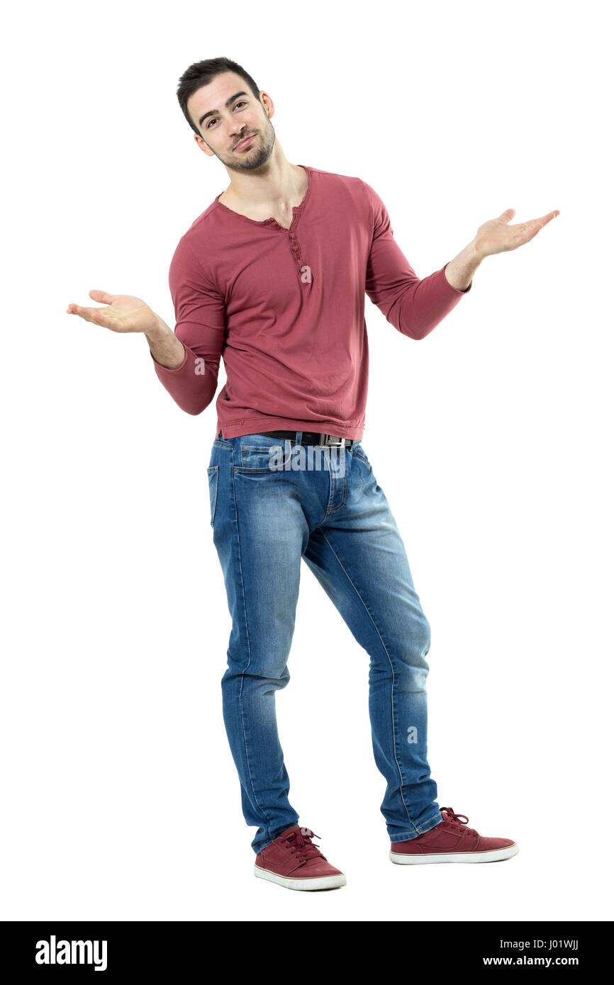 Happy puzzled stylish casual man shrugging shoulder with raised arms ...
