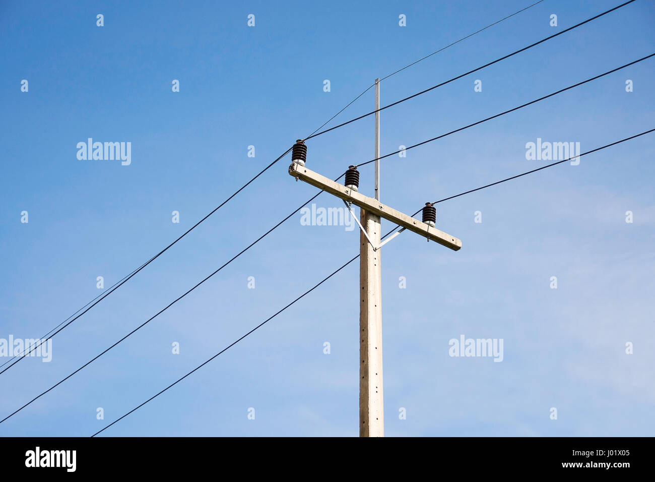 wire pole withe blue sky on bright day Stock Photo - Alamy