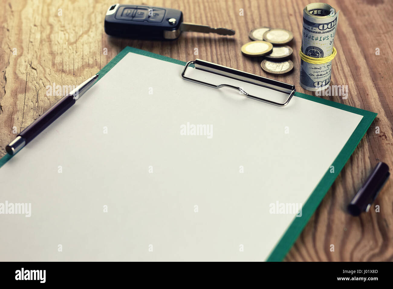 key money coin and empty paper Stock Photo - Alamy