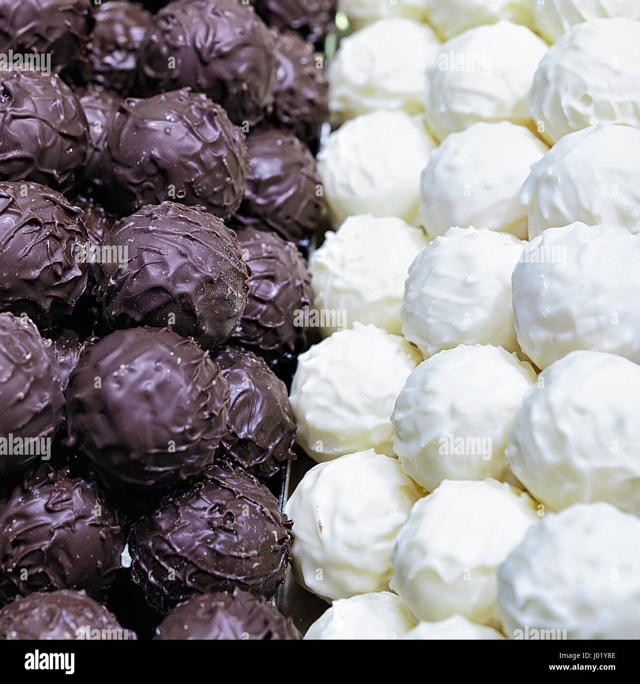 Collection of milk and white Swiss chocolate truffles Stock Photo - Alamy