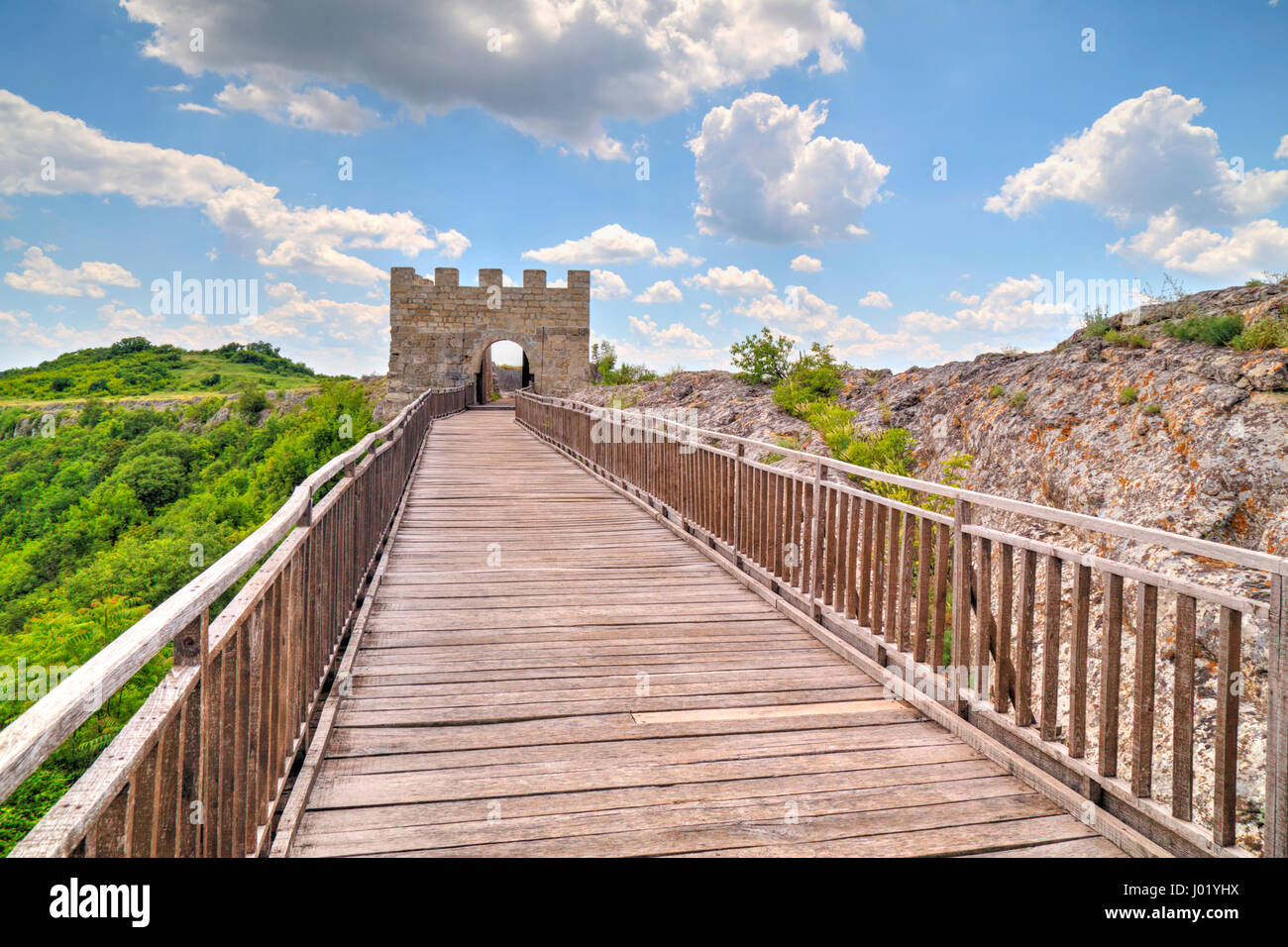 Stone walls and gate with wooden bridge of medieval fortress Stock ...