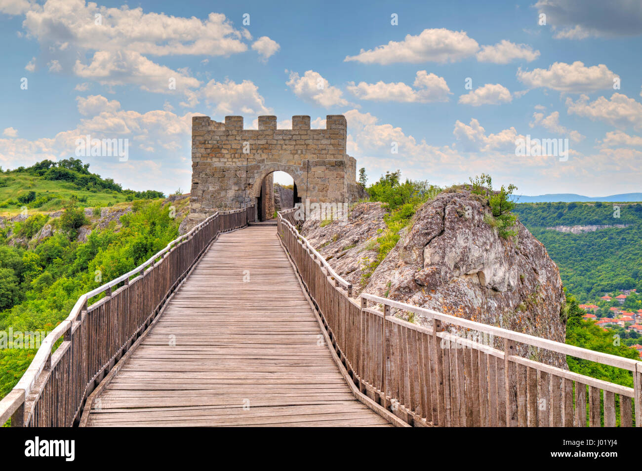 Stone walls and gate with wooden bridge of medieval fortress Stock ...