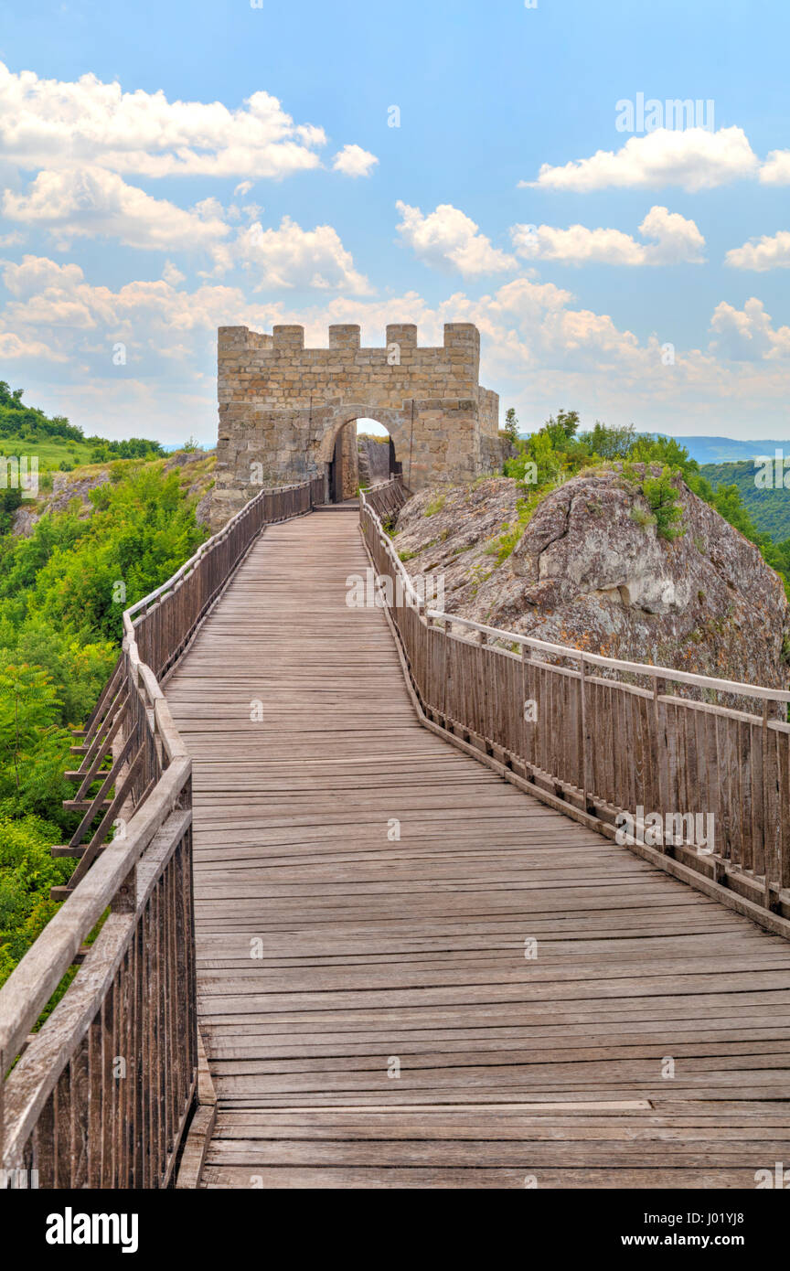 Stone walls and gate with wooden bridge of medieval fortress Stock ...