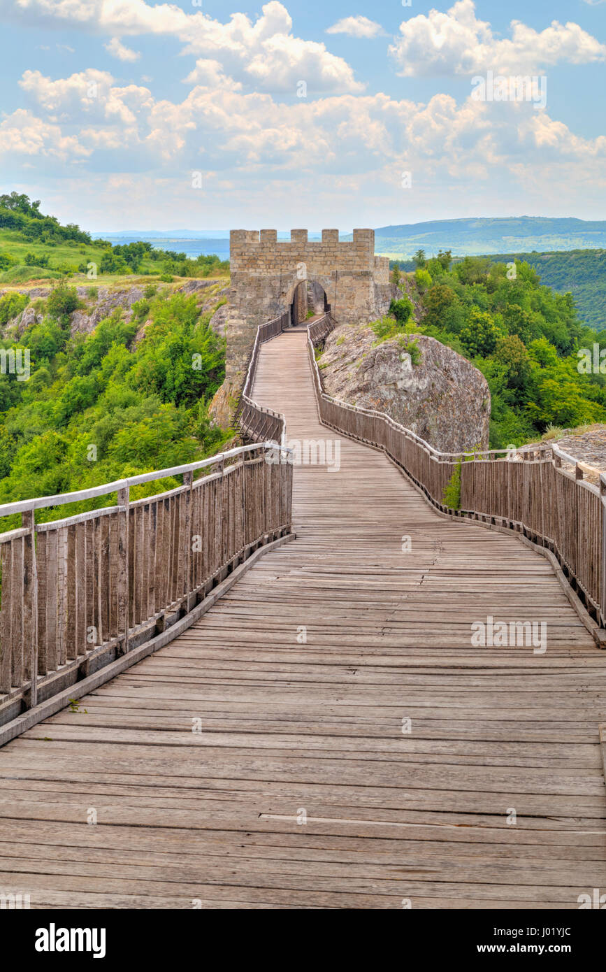 Stone walls and gate with wooden bridge of medieval fortress Stock ...